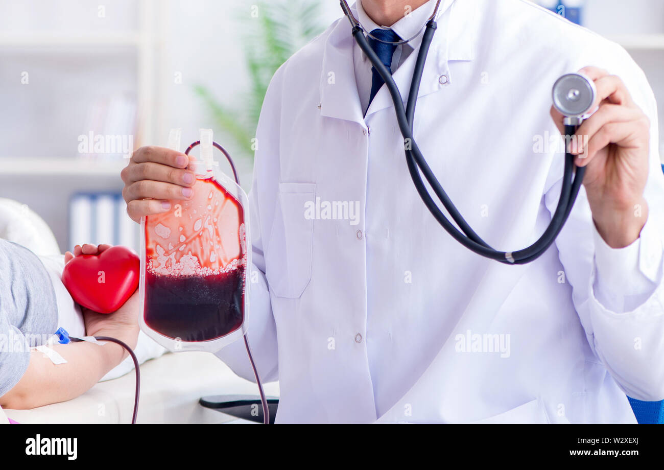 The patient getting blood transfusion in hospital clinic Stock Photo ...