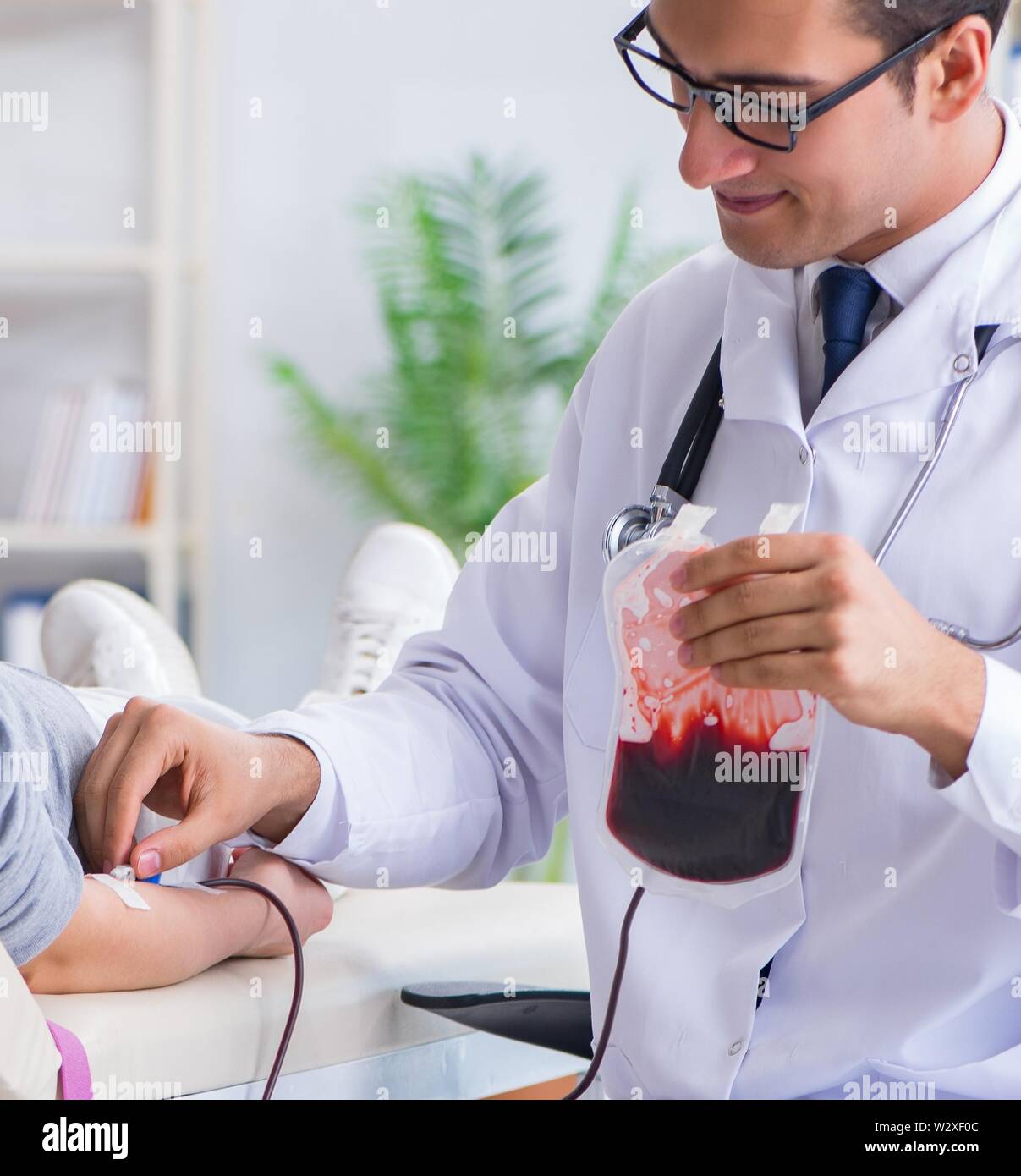 The patient getting blood transfusion in hospital clinic Stock Photo ...
