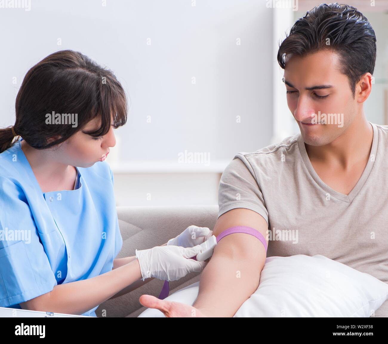 The patient getting blood transfusion in hospital clinic Stock Photo ...