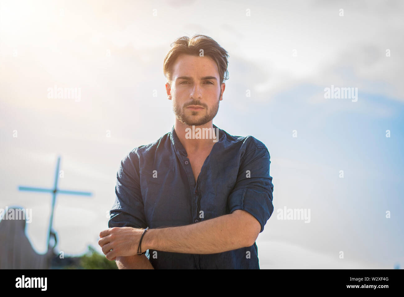 One handsome young man in city setting Stock Photo - Alamy