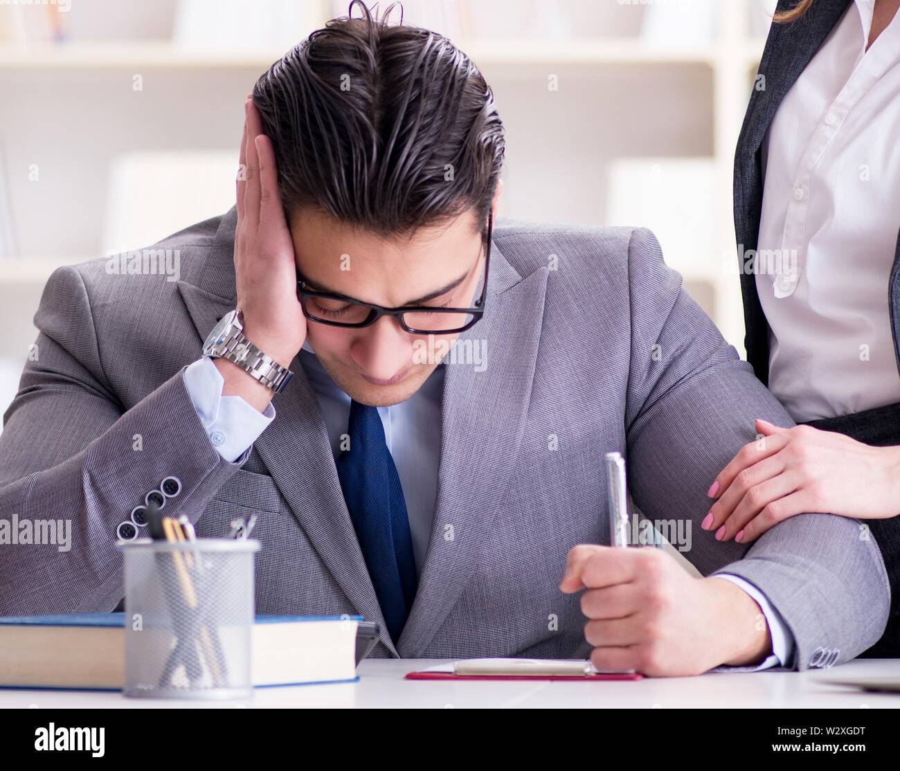 The unhappy boss having a chat with his secretary Stock Photo - Alamy