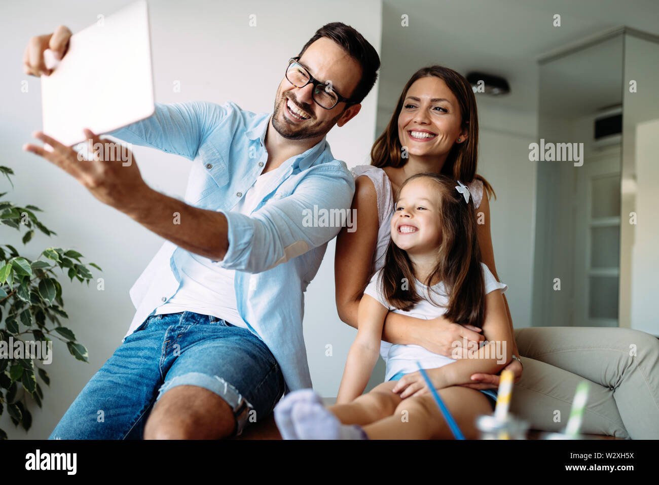 Happy family having fun time at home Stock Photo - Alamy