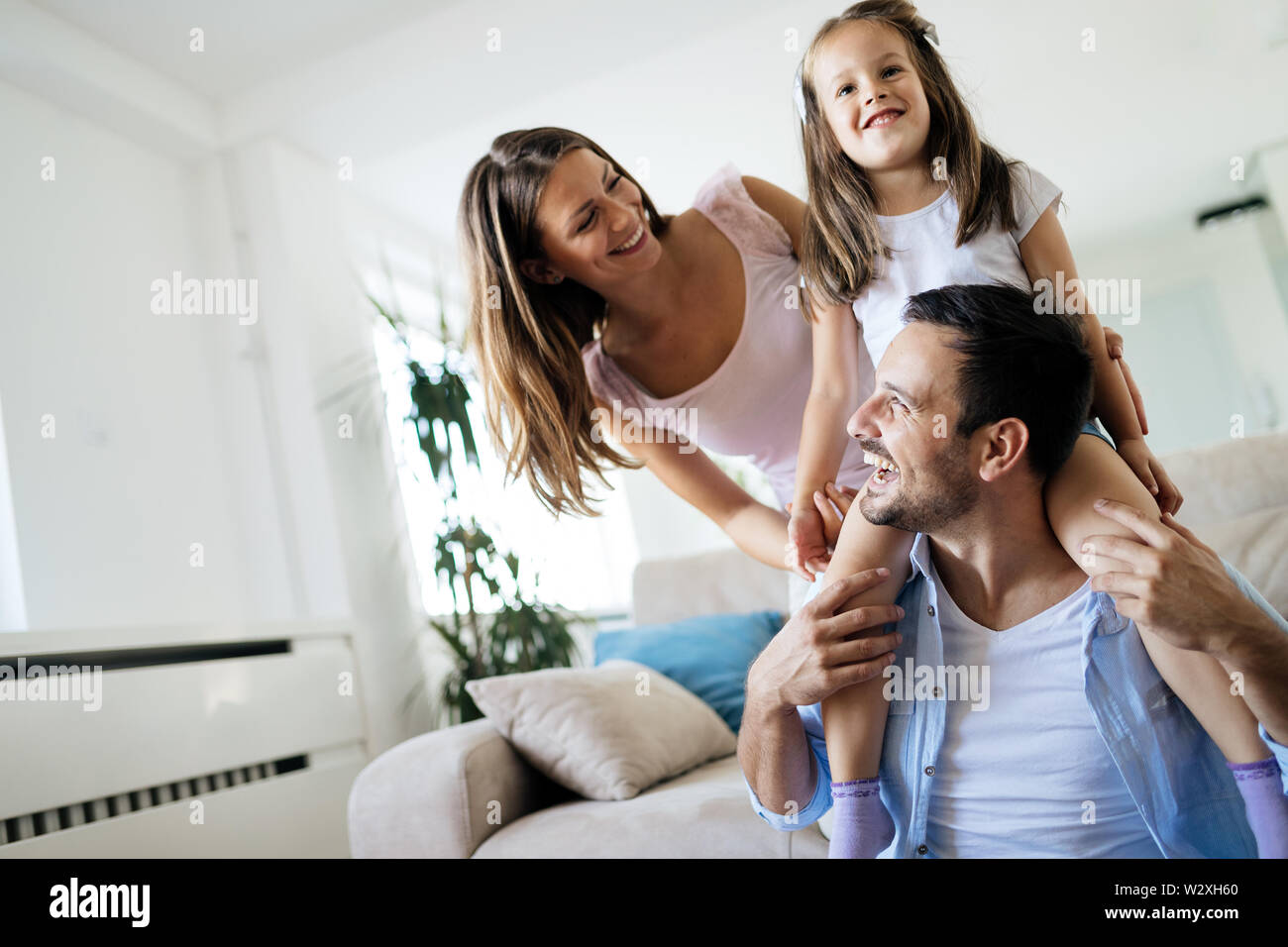 Happy family having fun time at home Stock Photo - Alamy