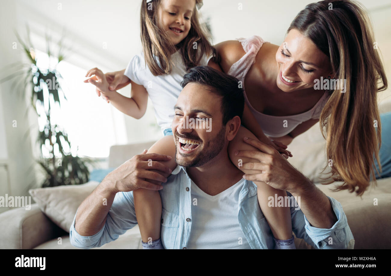 Happy family having fun time at home Stock Photo - Alamy