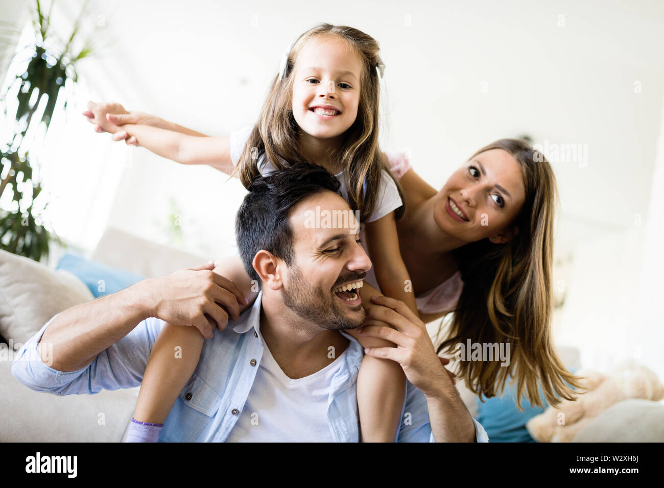 Happy family having fun time at home Stock Photo - Alamy