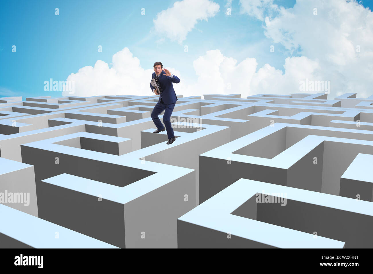 The businessman trying to escape from maze Stock Photo - Alamy