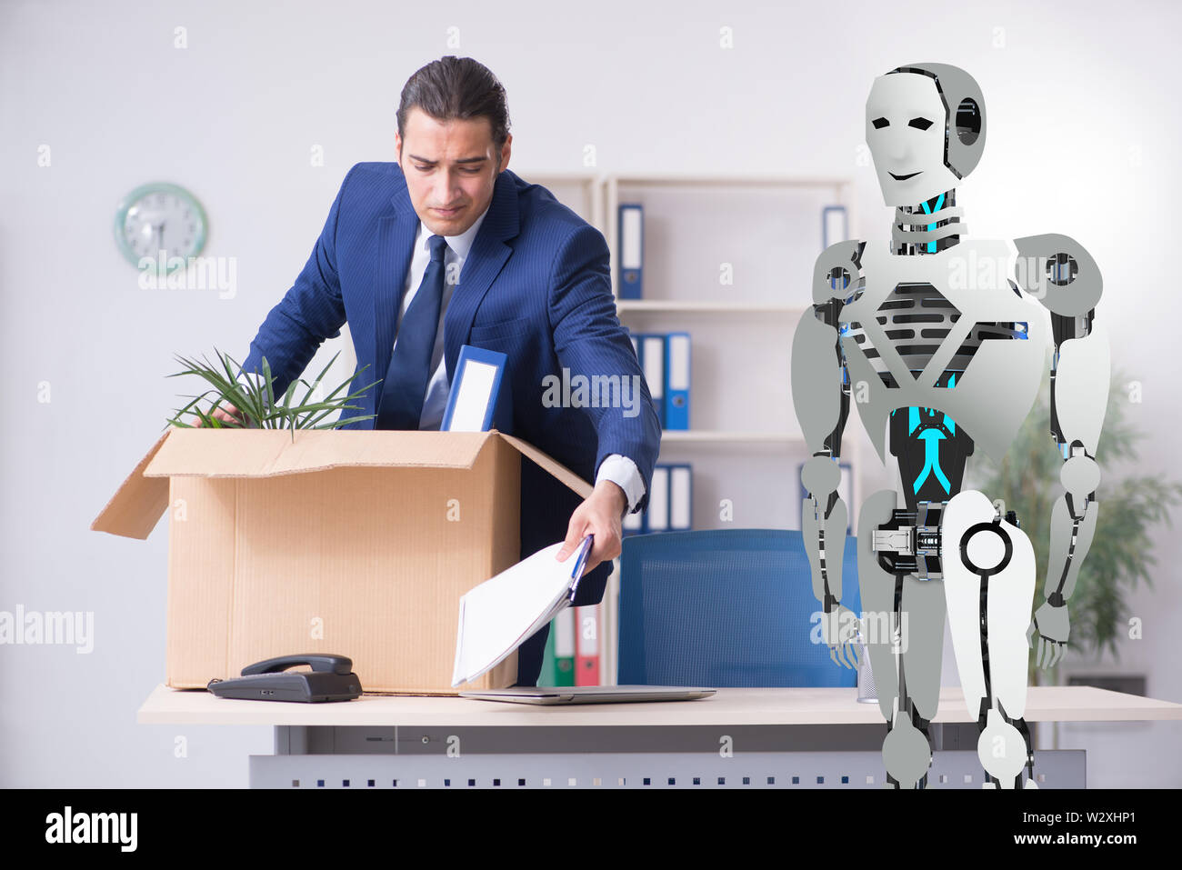 The concept of robots replacing humans in offices Stock Photo - Alamy