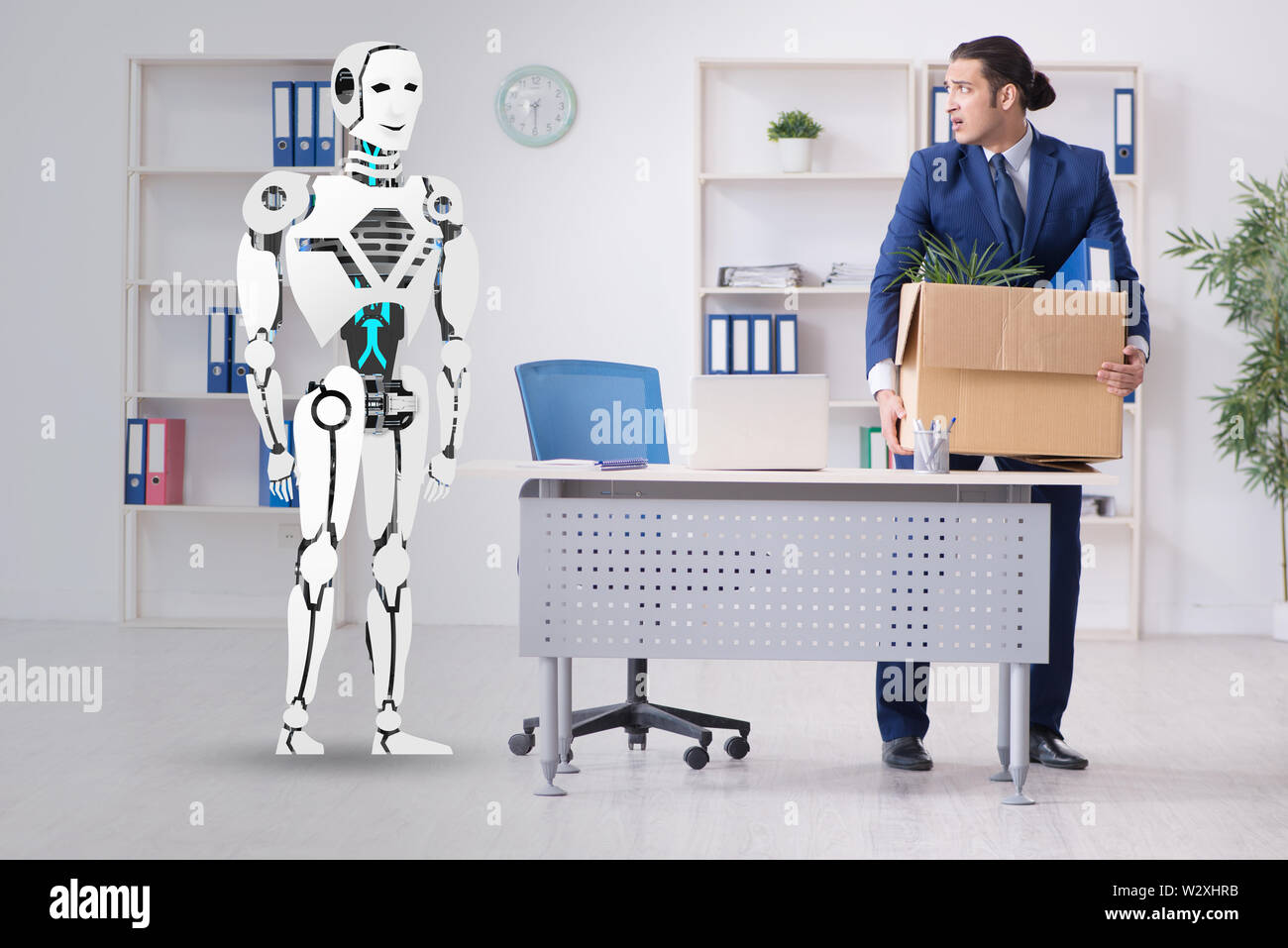 The concept of robots replacing humans in offices Stock Photo - Alamy