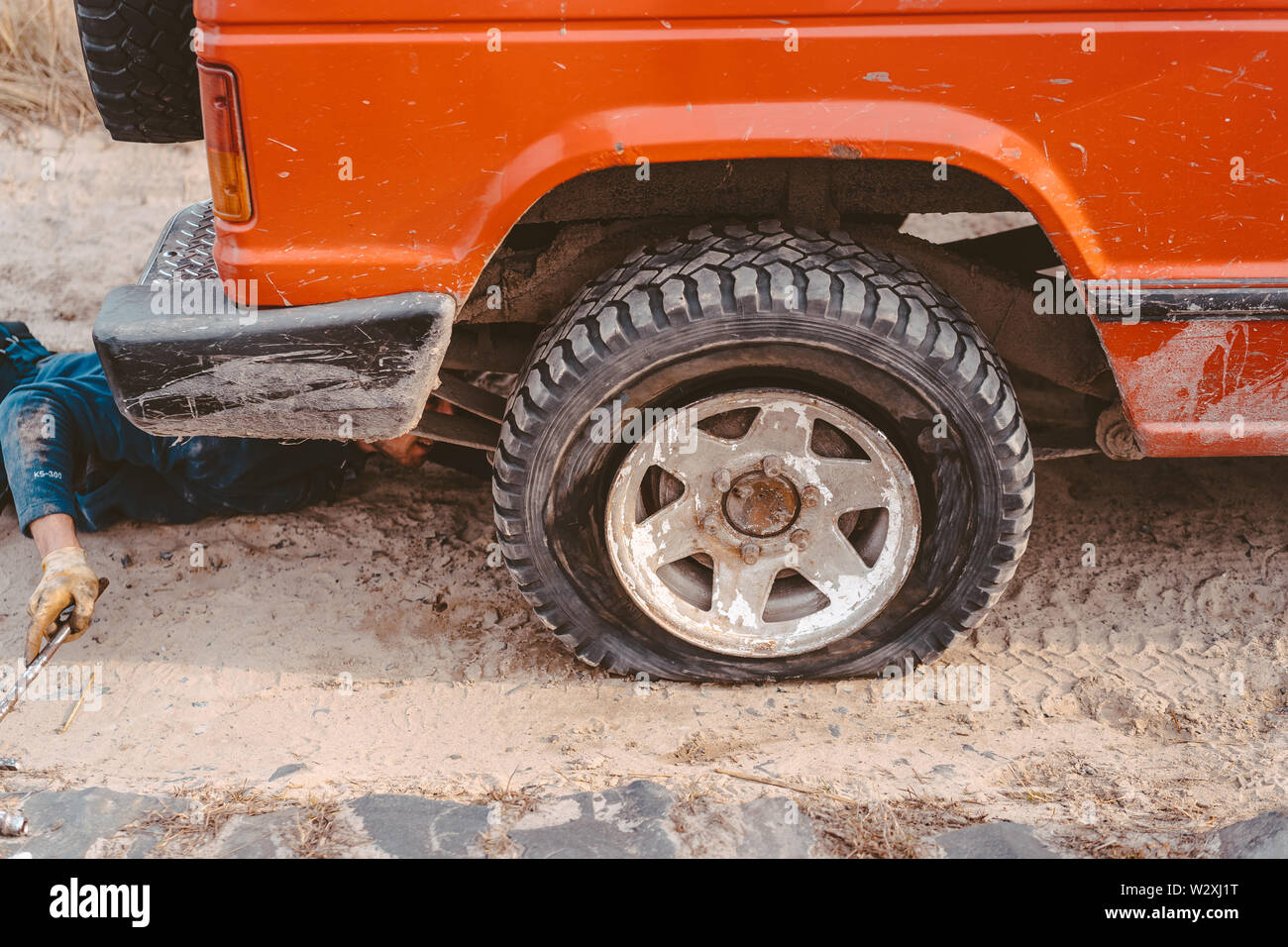 Man lying under car hi-res stock photography and images - Alamy