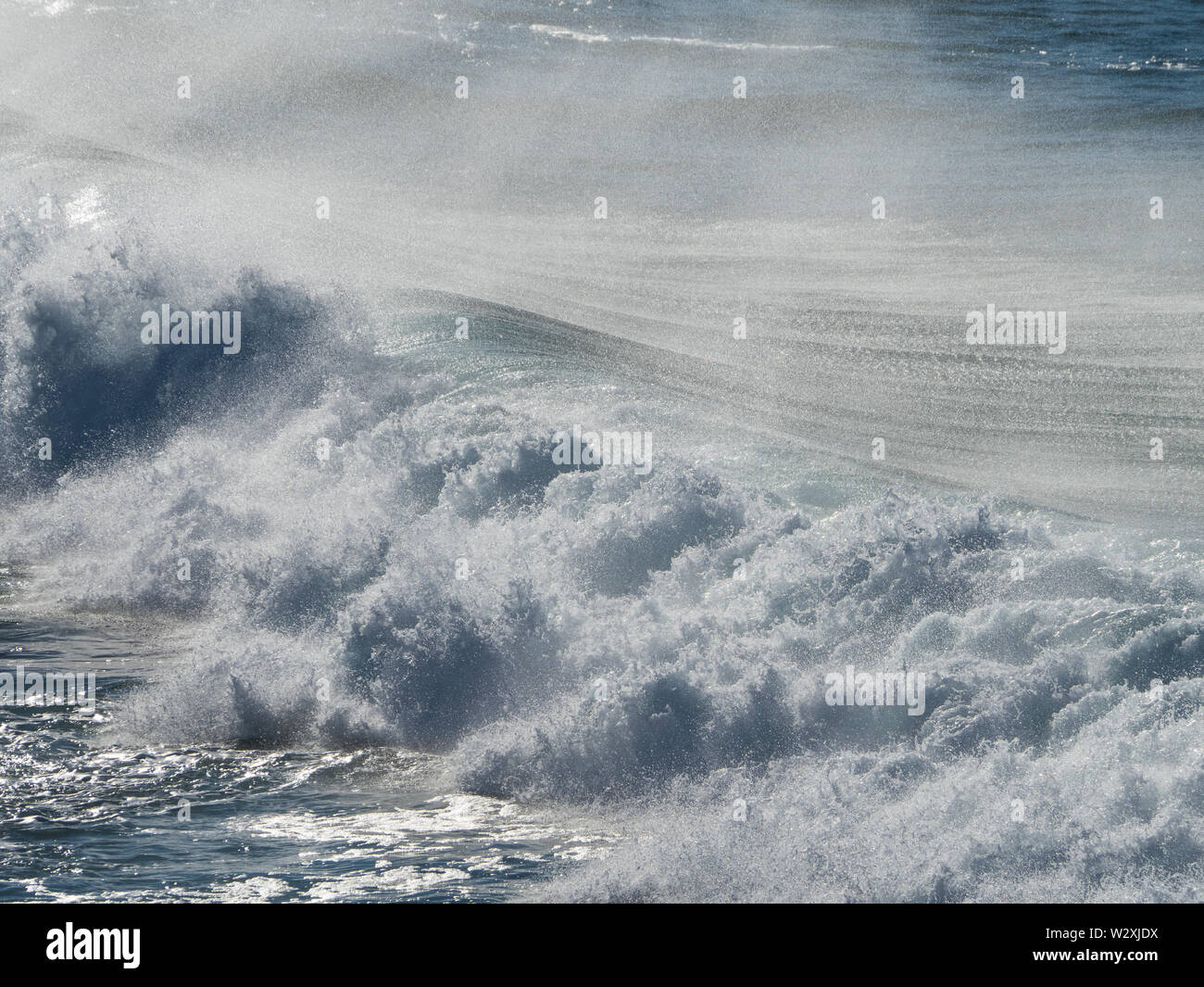 Waves with lots of sea spray Stock Photo - Alamy