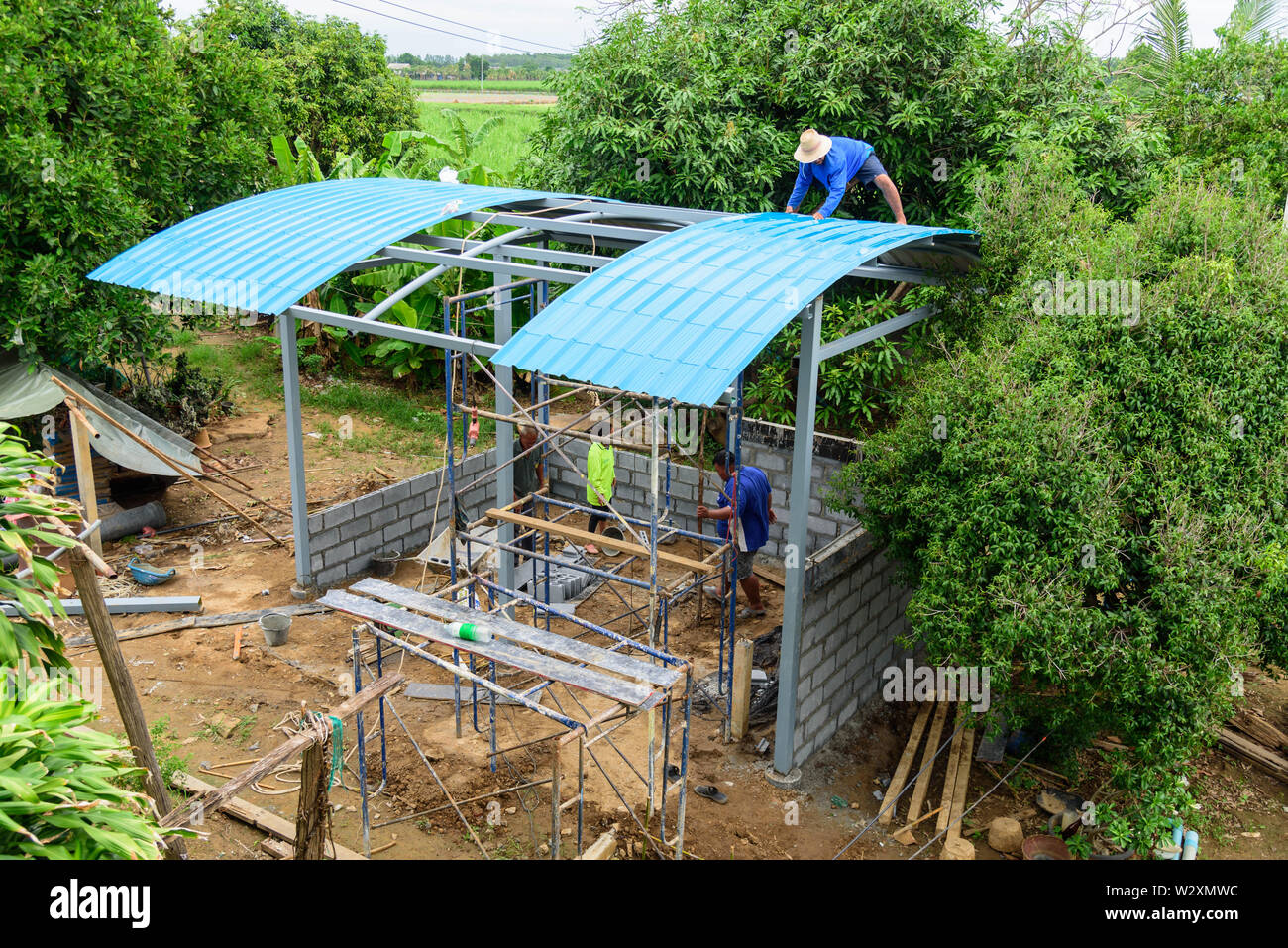 Worker welding the roof steel in construction site Stock Photo - Alamy