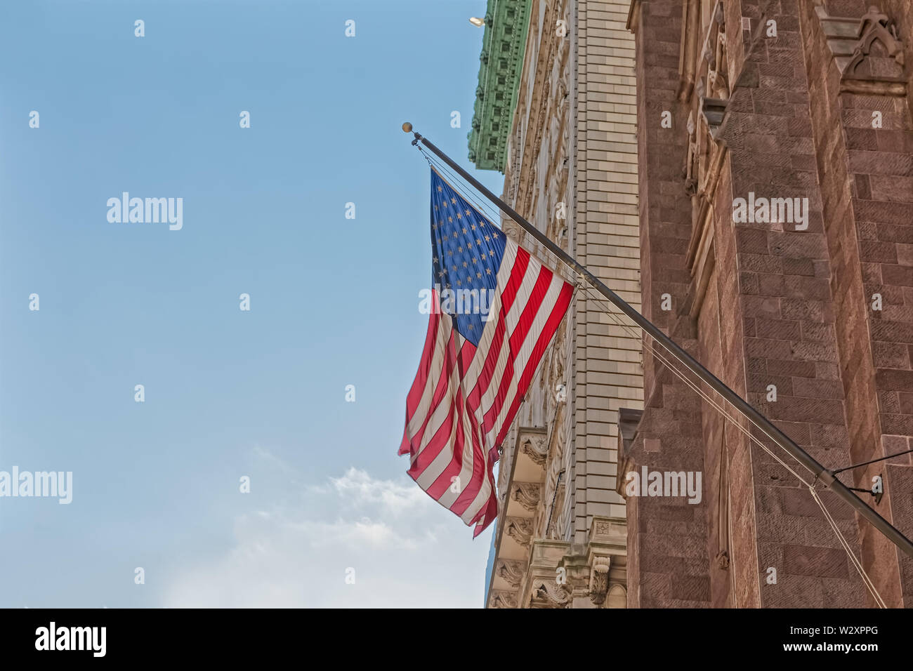 USA flag on facade of building in New York Stock Photo - Alamy