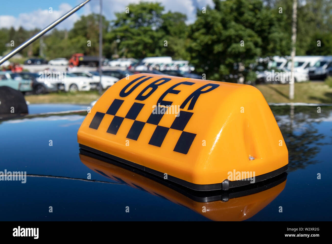 Uber taxi sign on top of a car Stock Photo - Alamy