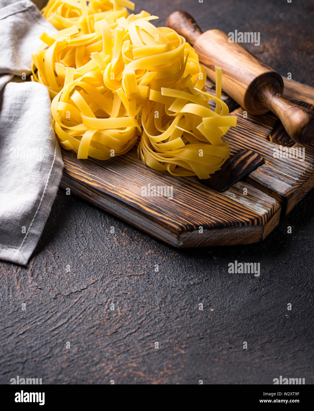 Raw uncooked homemade pasta tagliatelle or fettuccine Stock Photo - Alamy
