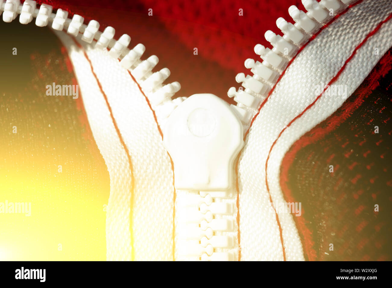 red sportswear closeup top view. white zip line on the wrong side ...
