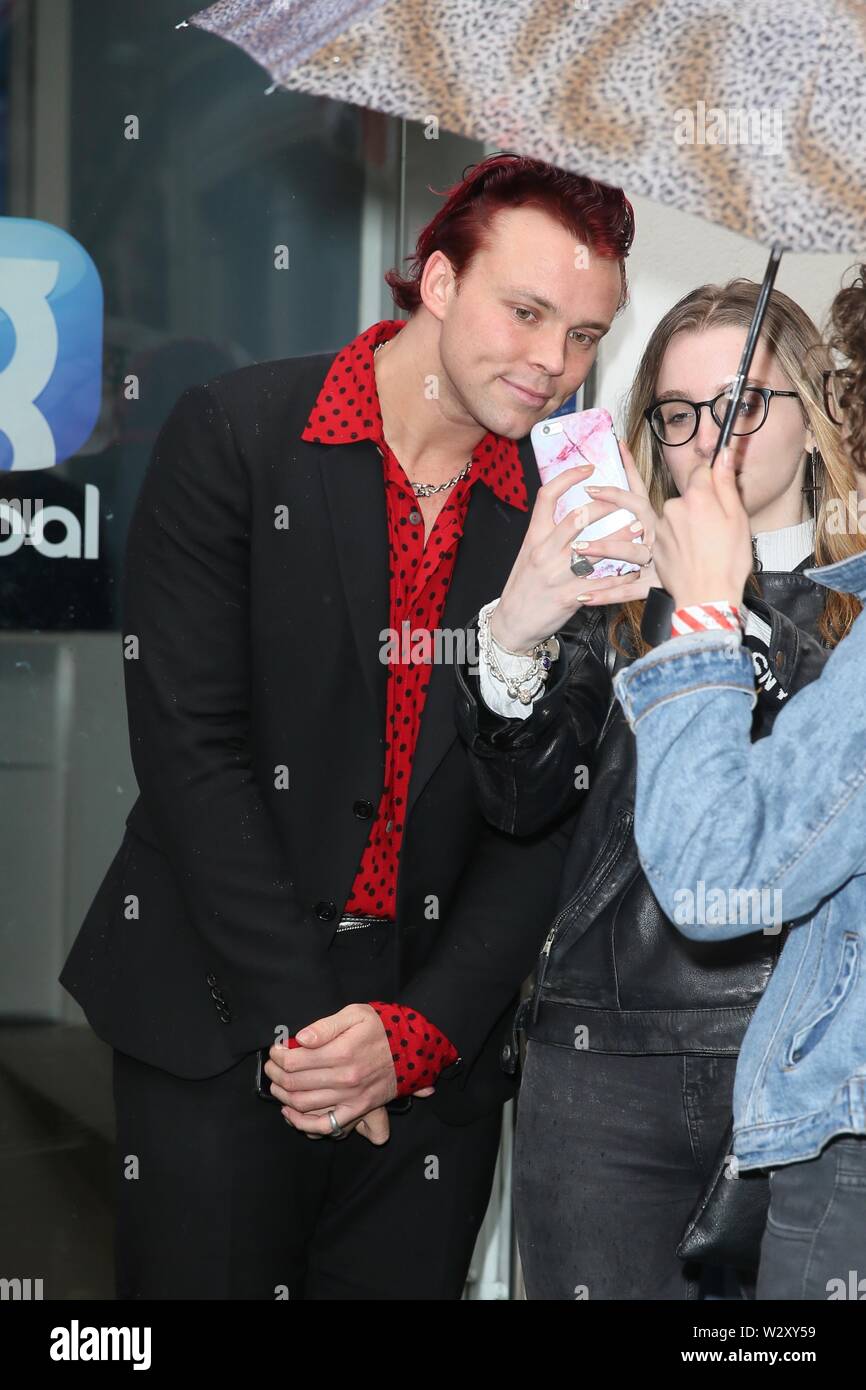 Five Seconds of Summer seen greeting fans as they leave Global studios after doing radio ...