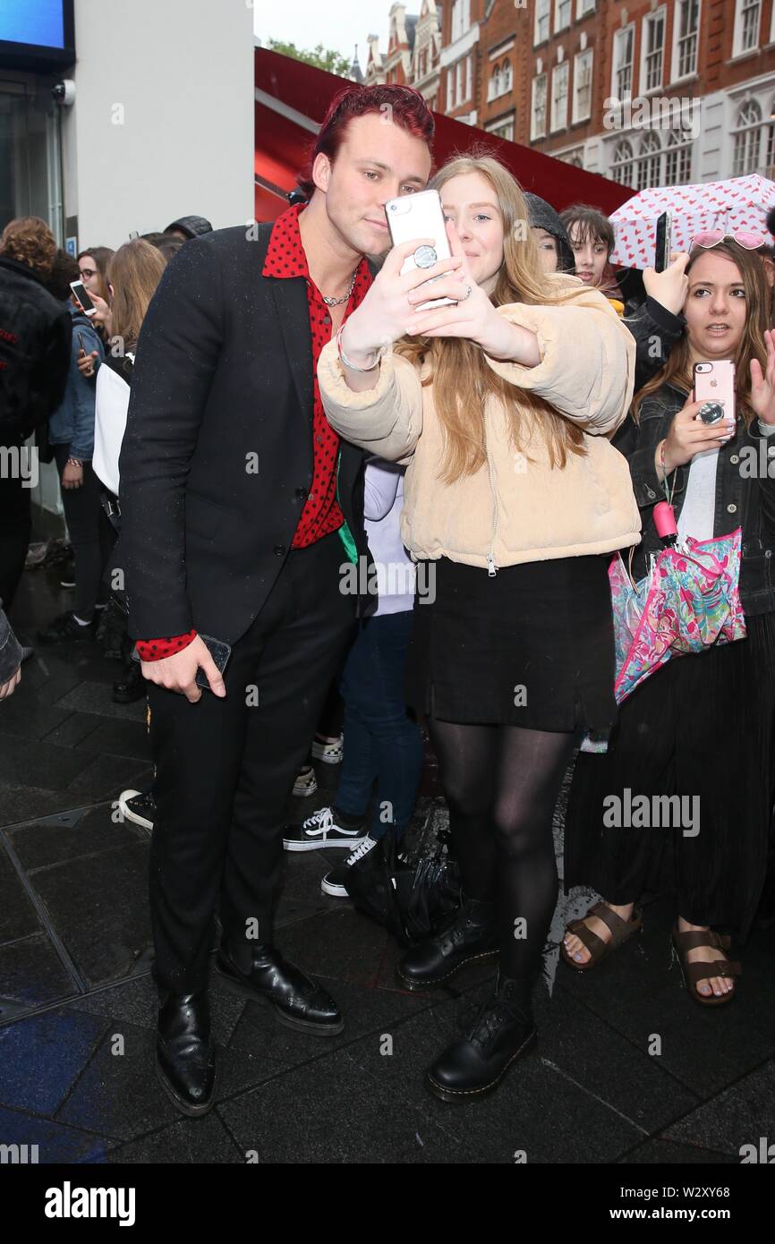 Five Seconds of Summer seen greeting fans as they leave Global studios after doing radio ...