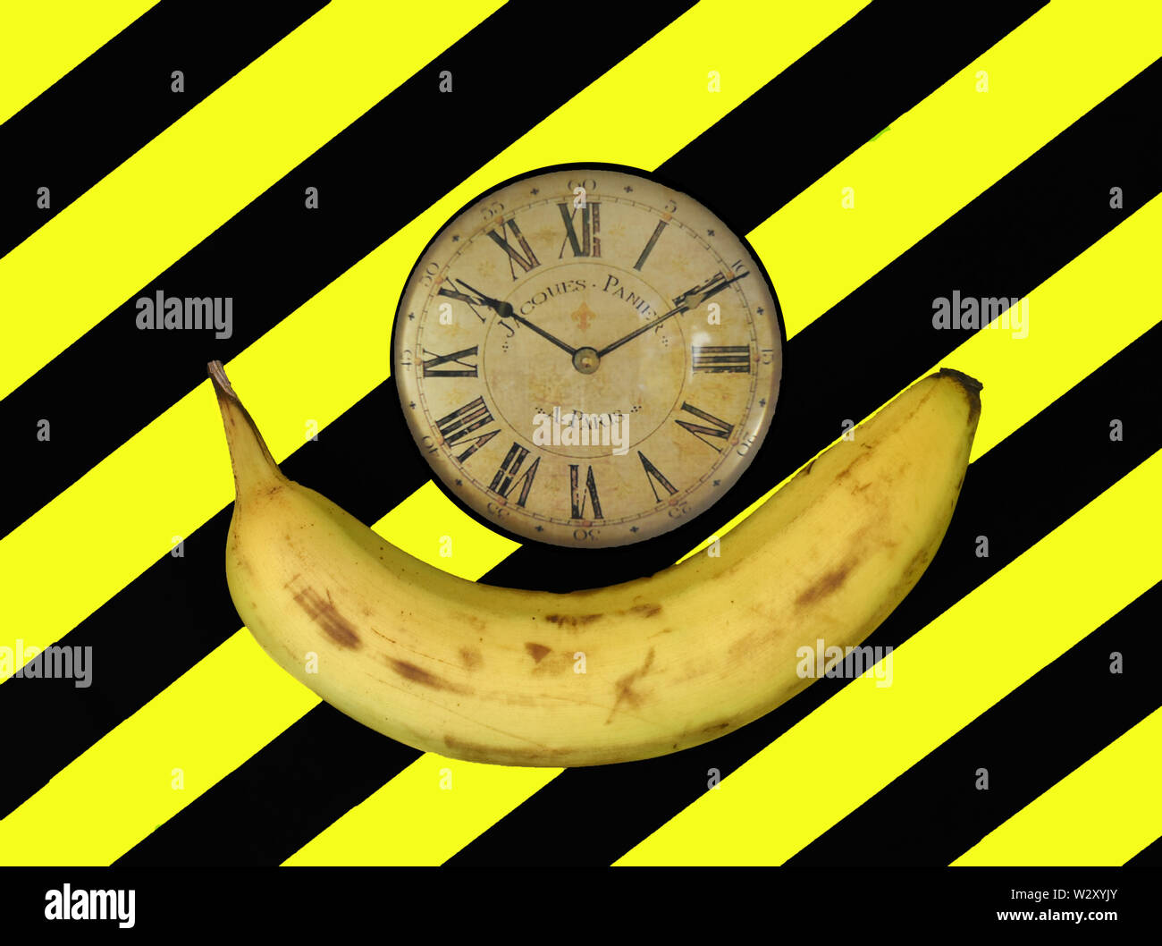 Creative Banana/Clock design on striking yellow and black diagonal ...
