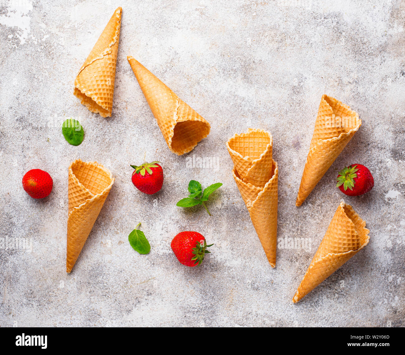 Empty waffle cones for ice cream and strawberry Stock Photo - Alamy