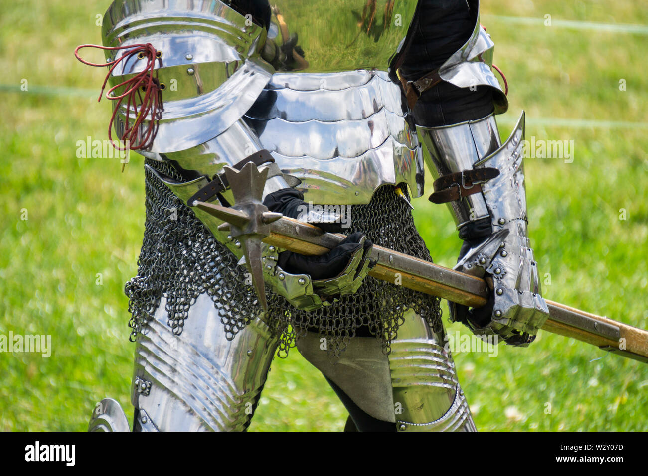 A medieval knight in amrour holding a weapon Stock Photo - Alamy