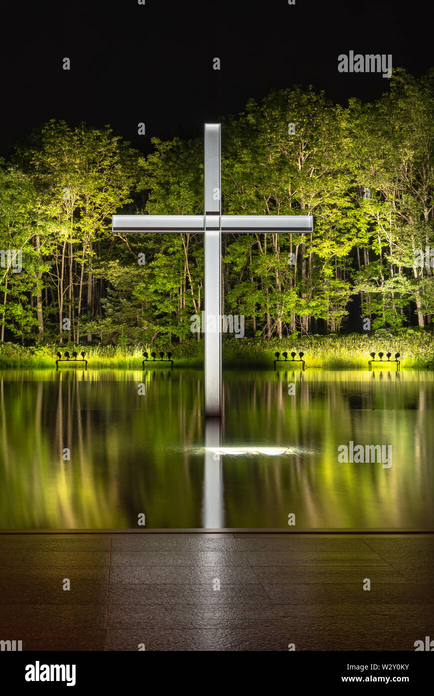 Cross on the water with an inverted reflection in a beautiful nature ...