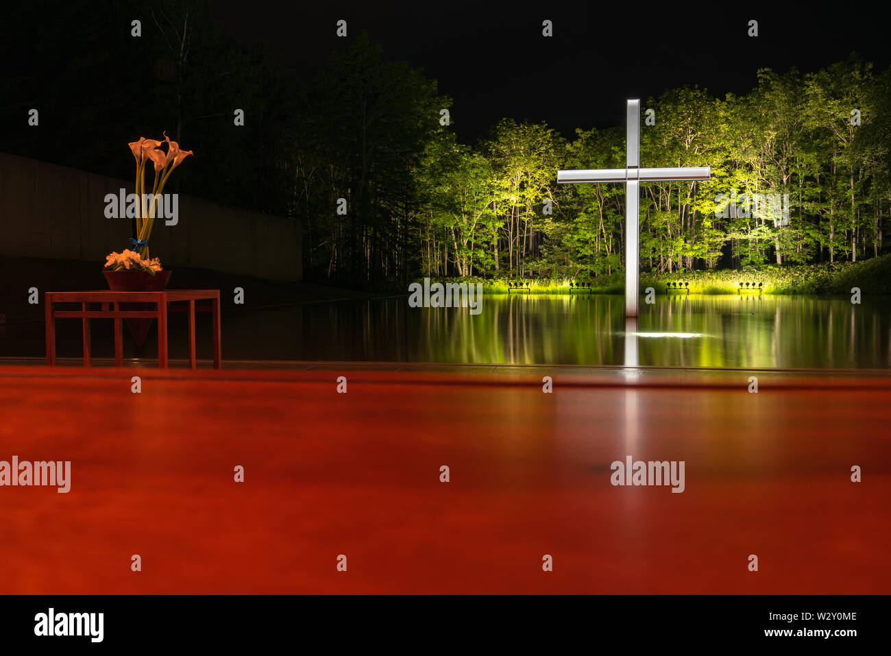 Cross on the water with an inverted reflection in a beautiful nature ...