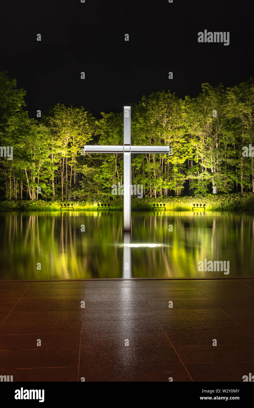 Cross on the water with an inverted reflection in a beautiful nature ...