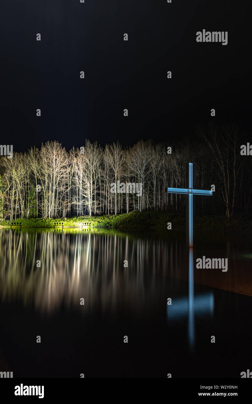 Cross on the water with an inverted reflection in a beautiful nature ...