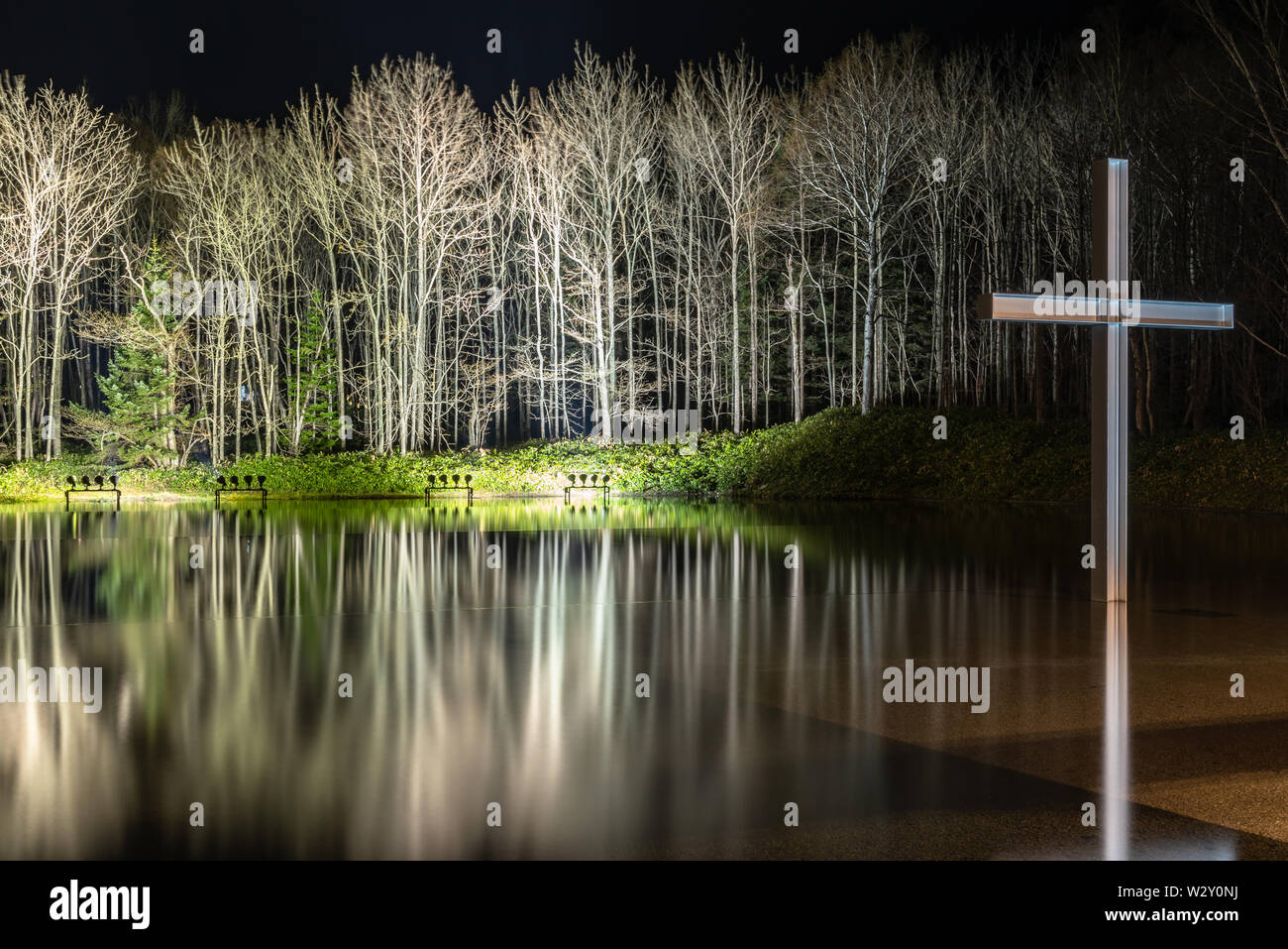 Cross on the water with an inverted reflection in a beautiful nature ...