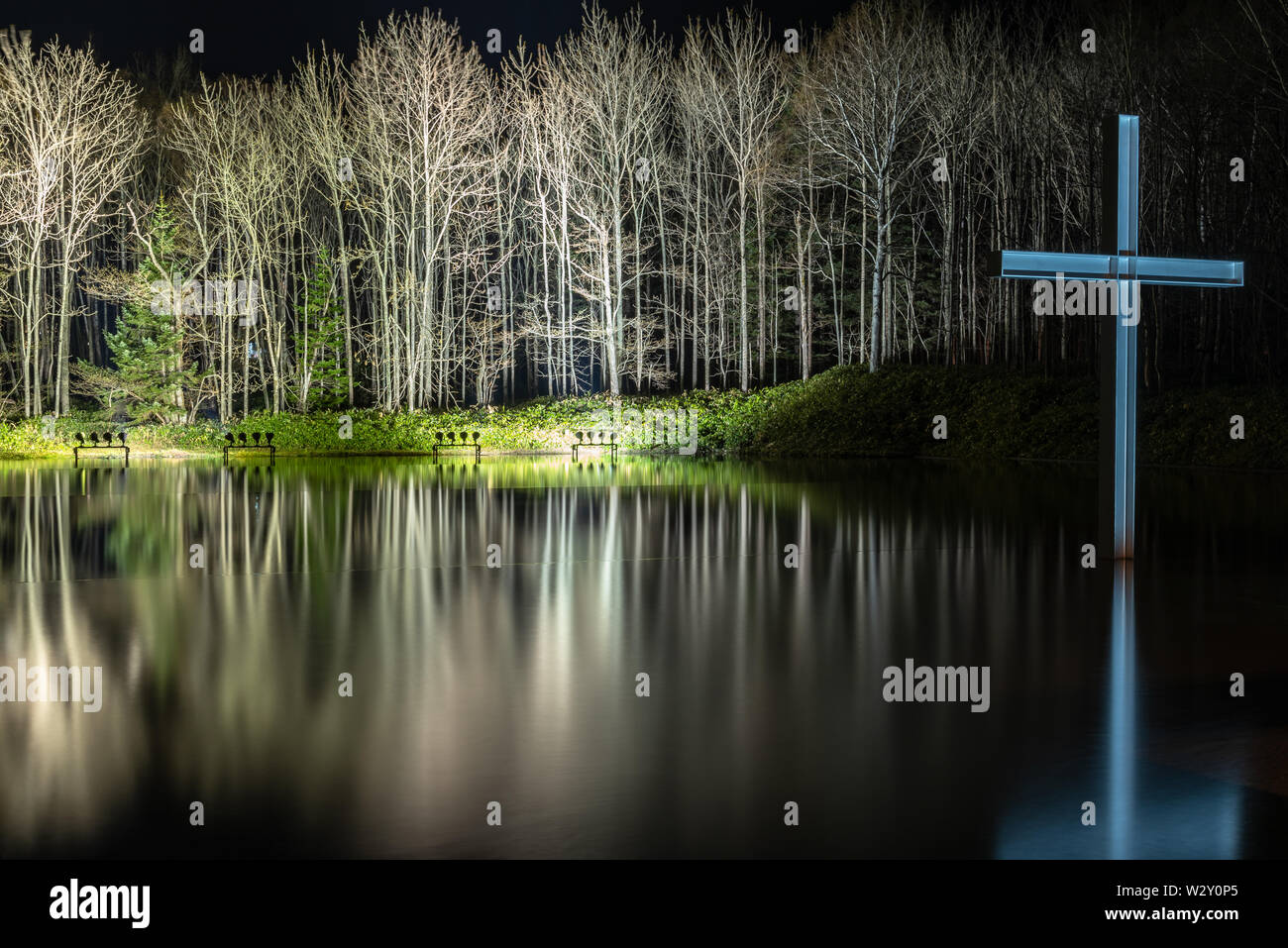 Cross on the water with an inverted reflection in a beautiful nature ...