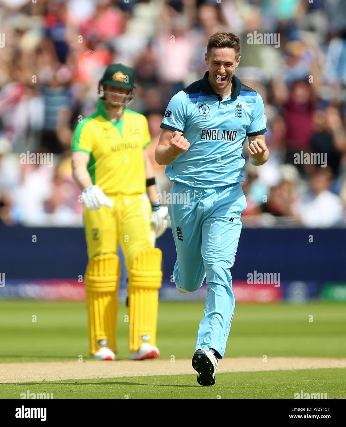 England's Chris Woakes celebrates taking the wicket of Australlia's ...