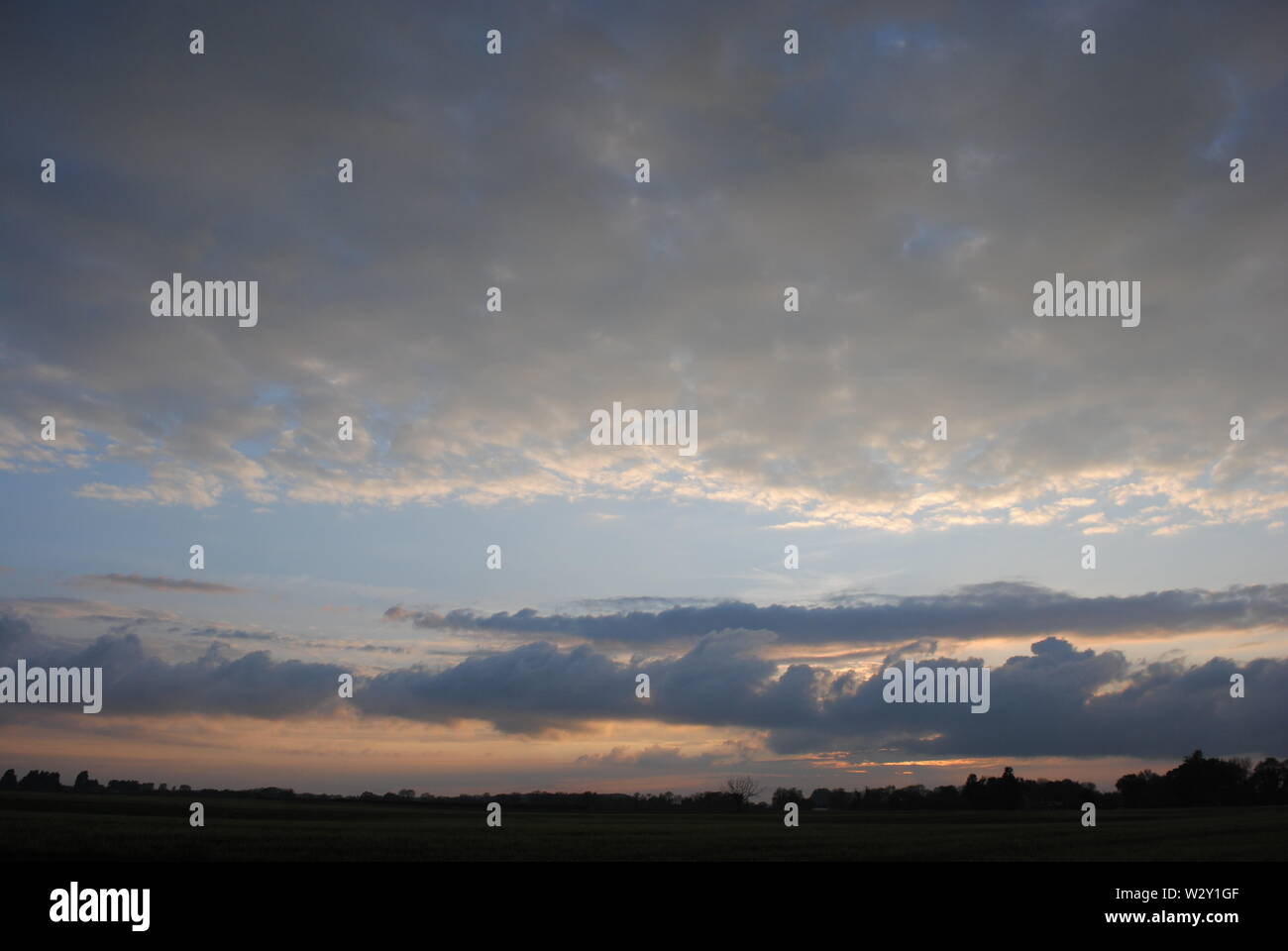 majestic sweeping evening clods in the sky over the landscape of ...