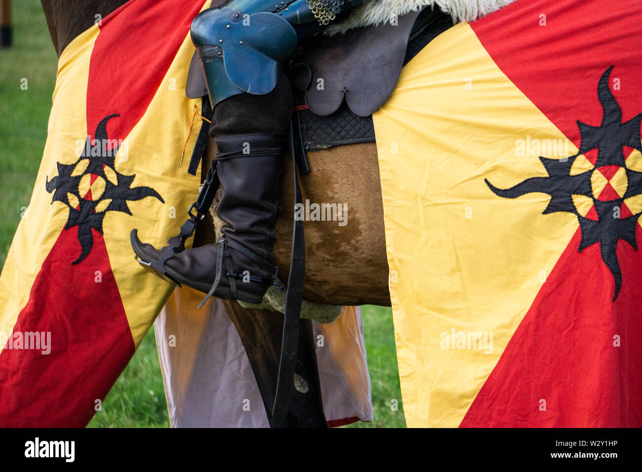 Close up of the foot of a medieval knight on horseback Stock Photo - Alamy