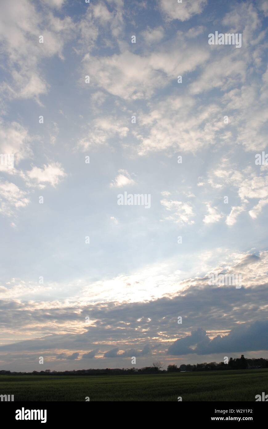 majestic sweeping evening clods in the sky over the landscape of ...