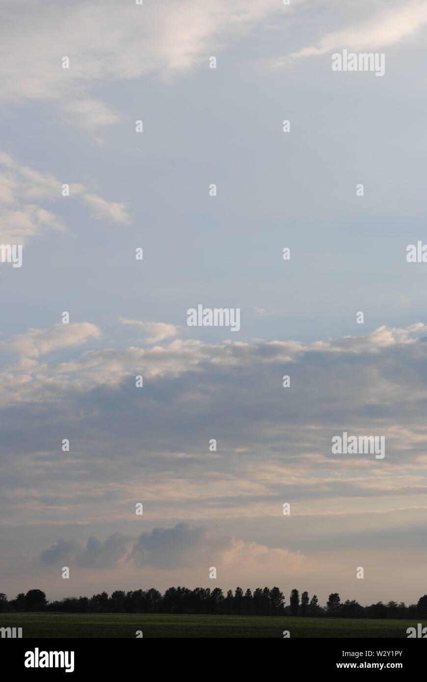 majestic sweeping evening clods in the sky over the landscape of ...