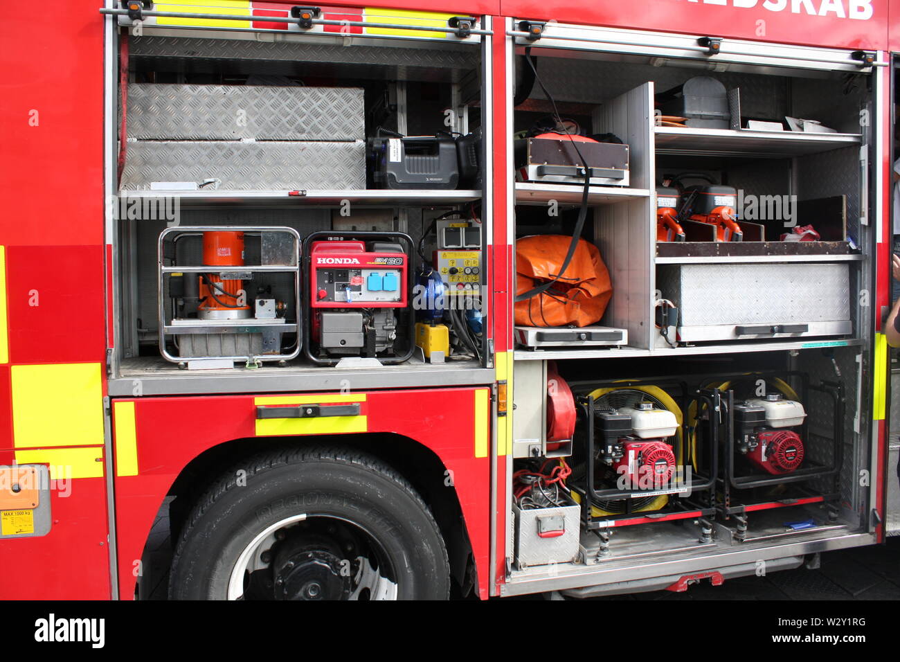 Modern firefighter truck with an emergency tool and equipment for using ...