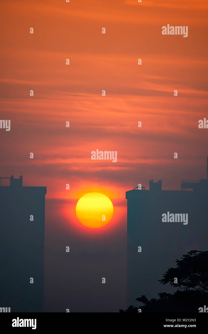 The early morning sunlight shining on large buildings Stock Photo - Alamy