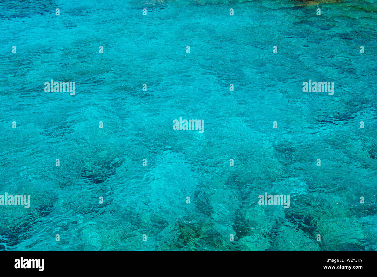 Turquoise sea water background with small ripples Stock Photo - Alamy