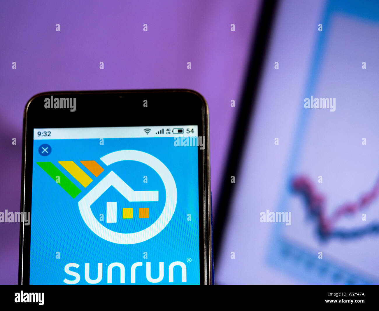 In this photo illustration the Sunrun Inc. logo is seen displayed on a smartphone Stock Photo ...