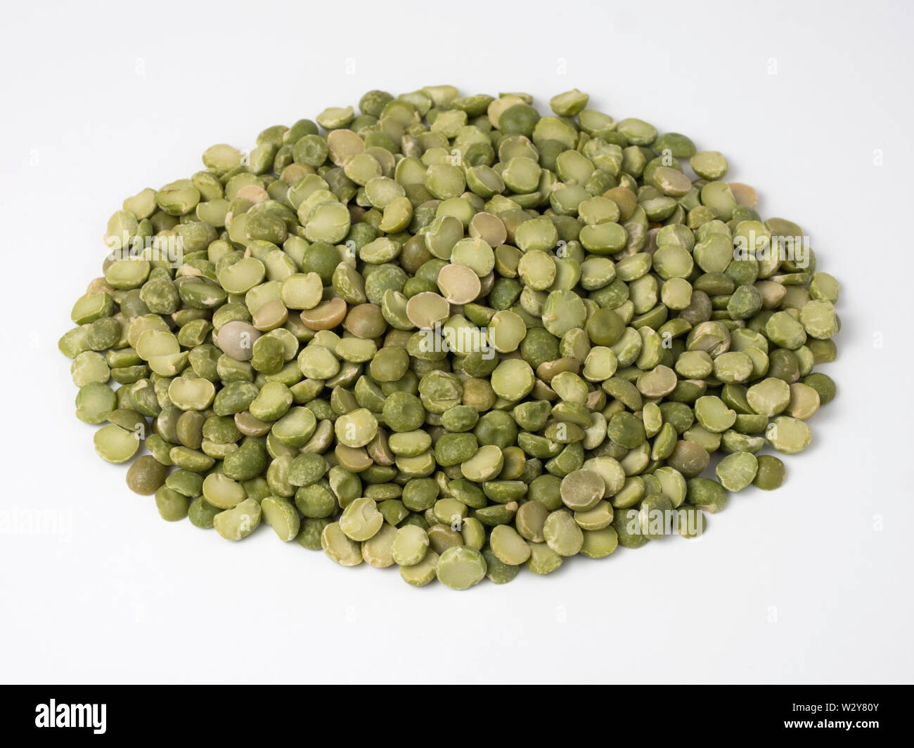 Green dry peas in a pile isolated on a white background Stock Photo - Alamy