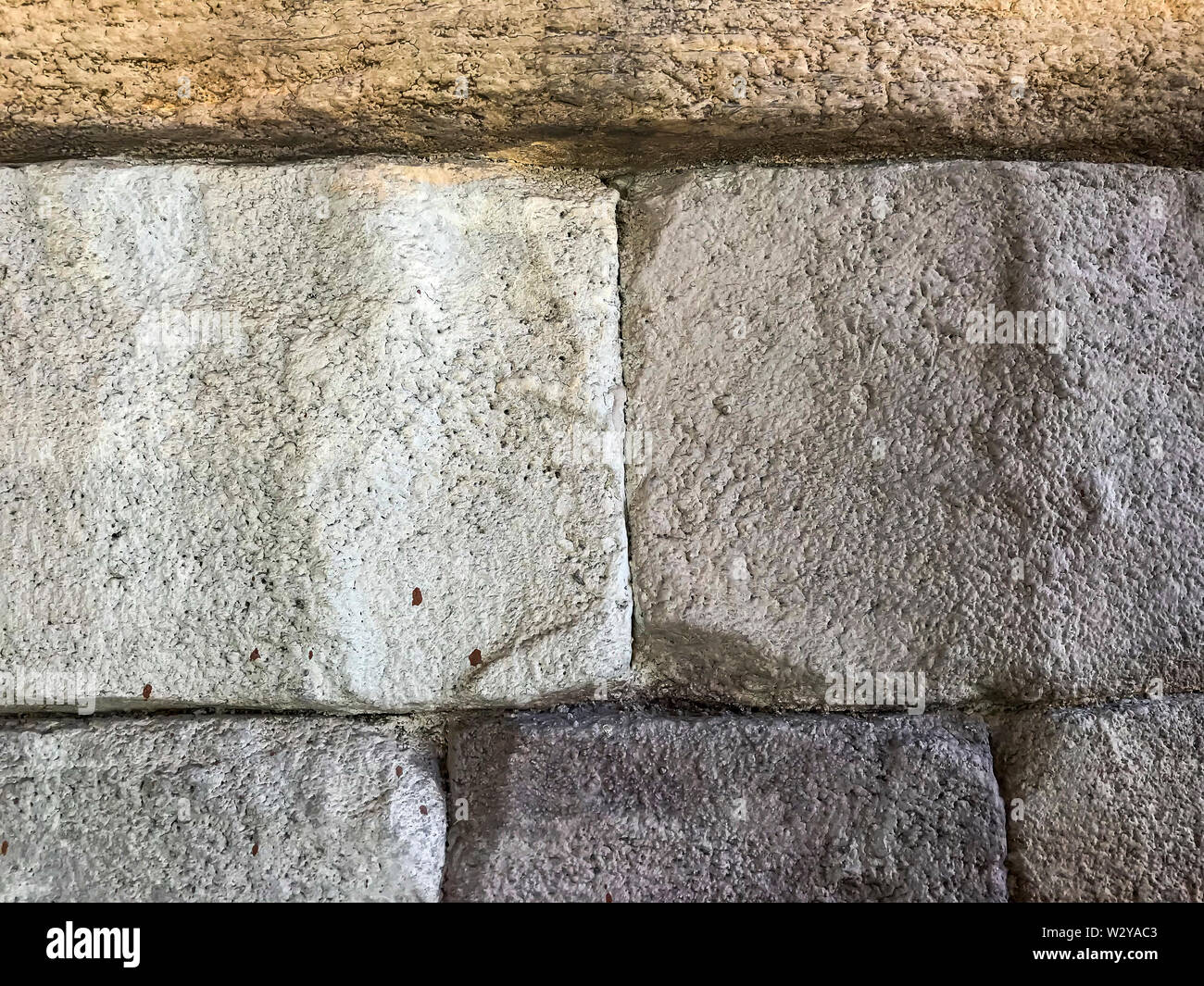 Decorative wall of colored stone bricks Stock Photo - Alamy