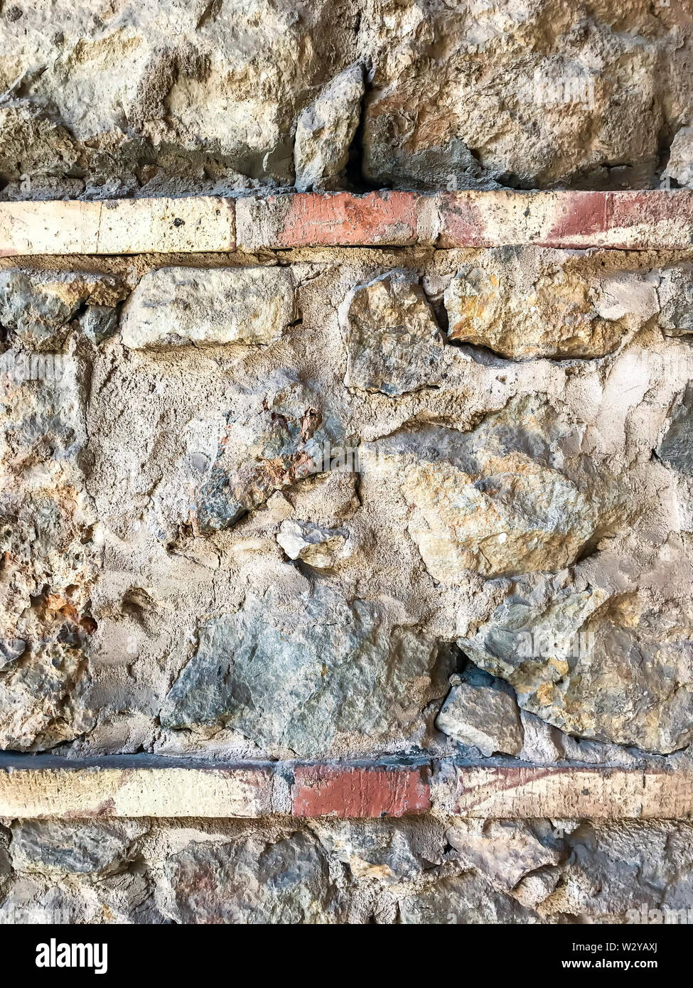 Decorative wall of colored stone bricks Stock Photo - Alamy