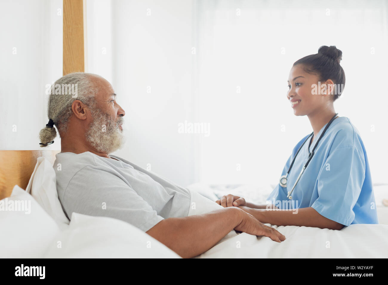 Old man talking to young person hi-res stock photography and images - Alamy