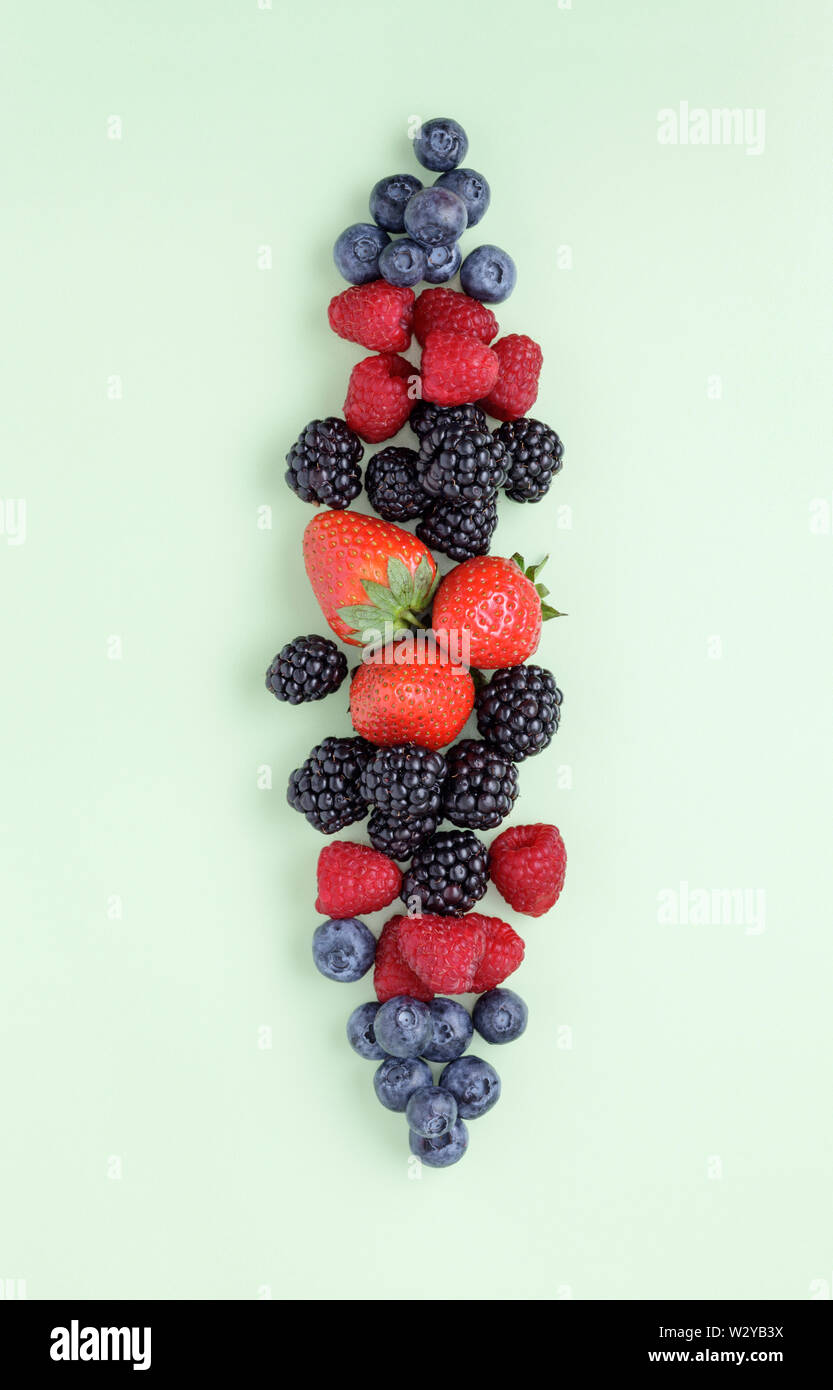 Summer Berries on plain green background Stock Photo - Alamy