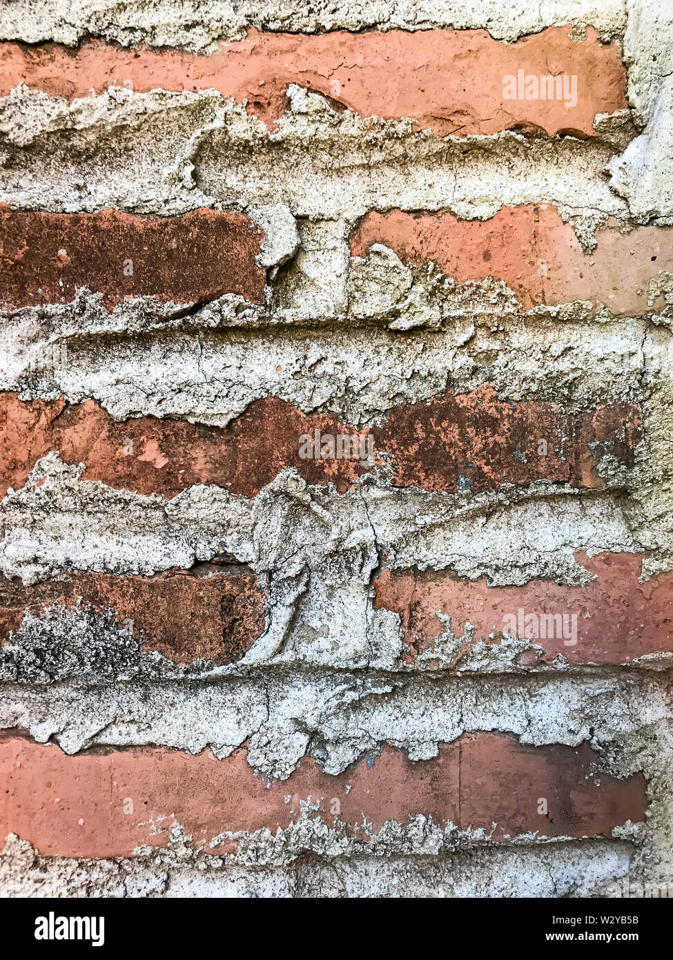 Decorative wall of colored stone bricks Stock Photo - Alamy