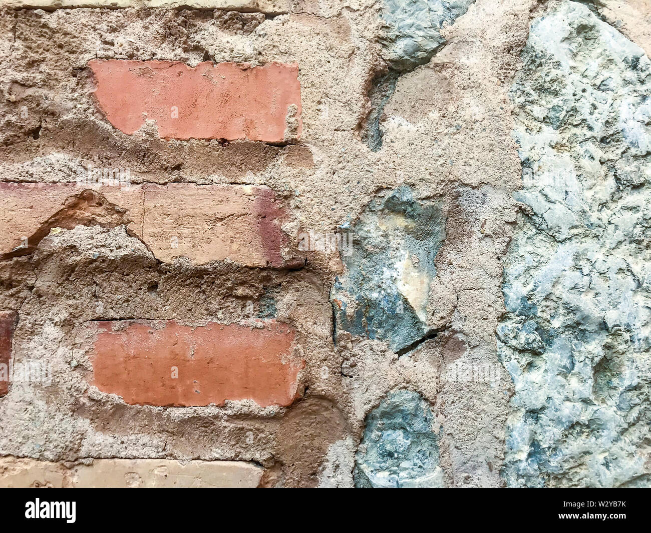 Decorative wall of colored stone bricks Stock Photo - Alamy