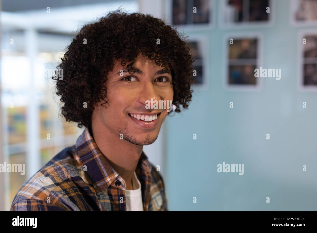 Male graphic designer smiling Stock Photo - Alamy