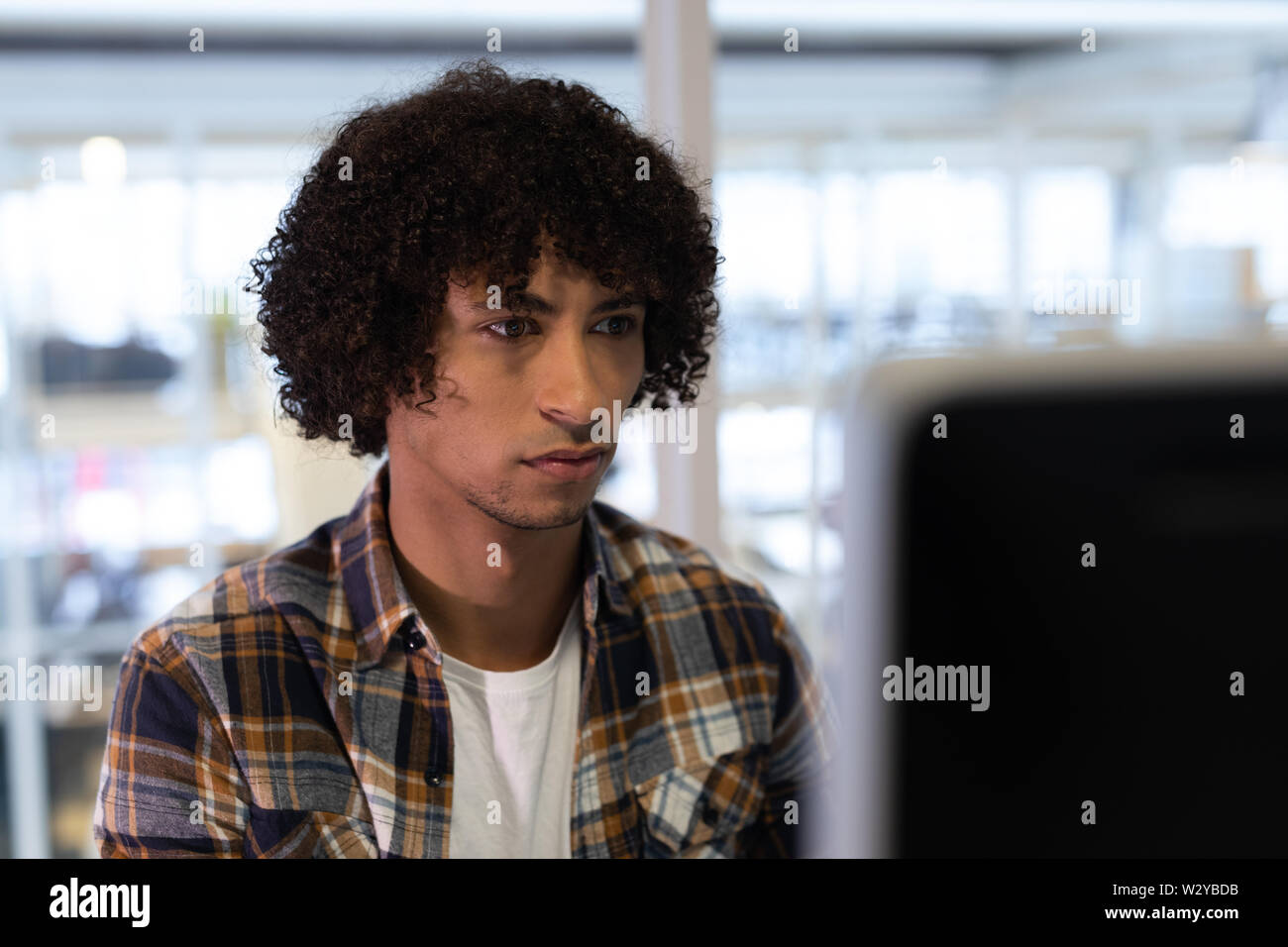 Male graphic designer working on computer Stock Photo - Alamy