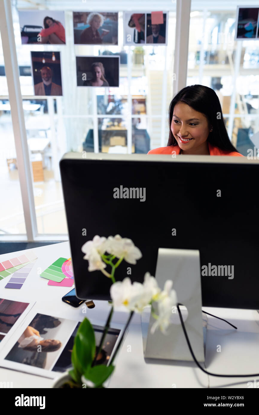 Female graphic designer working on computer Stock Photo - Alamy