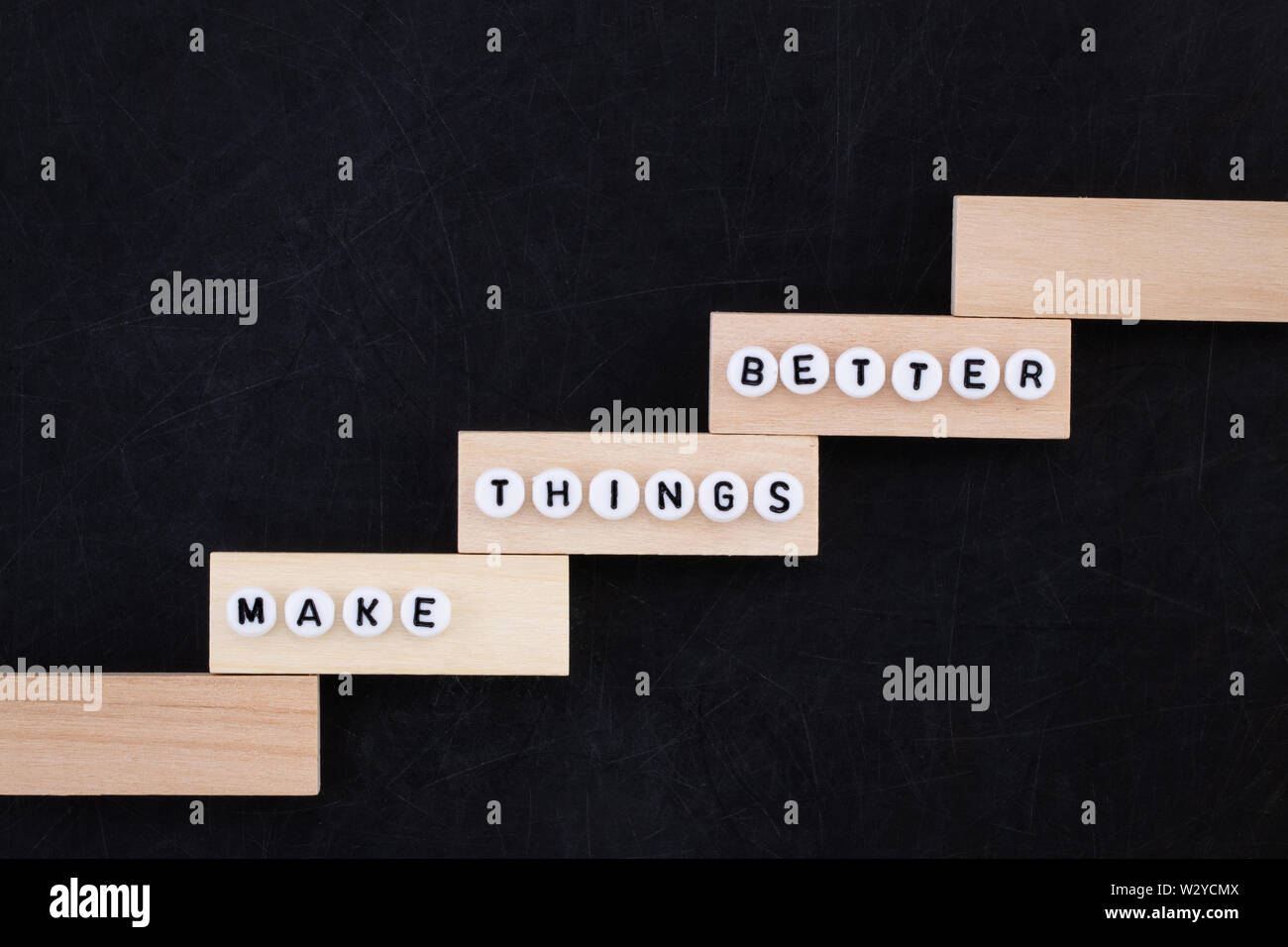 Make things better - Improvement Concept. Black background Stock Photo ...